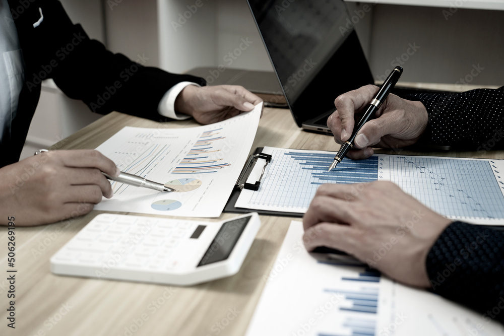 Business staff team meeting to create a marketing plan using graphs ...