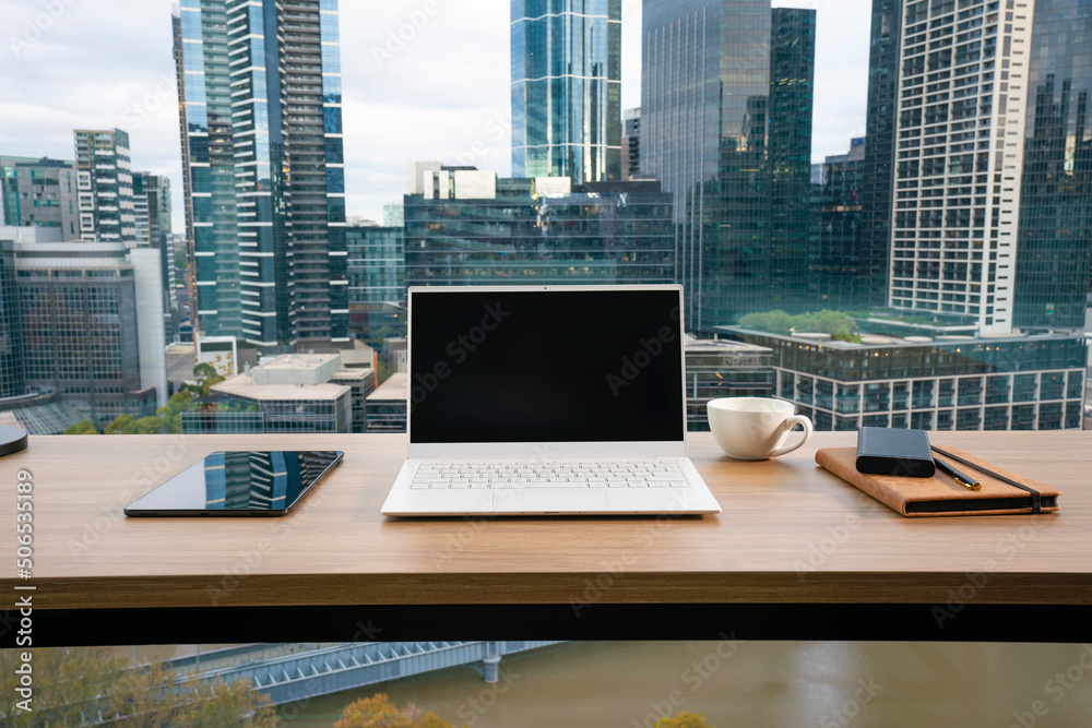 Office desk, out focus city skyline background Stock Photo | Adobe Stock