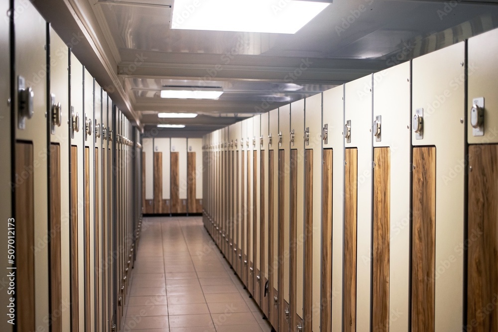 rows of lockers in a dressing room for changing and storing clothes at ...