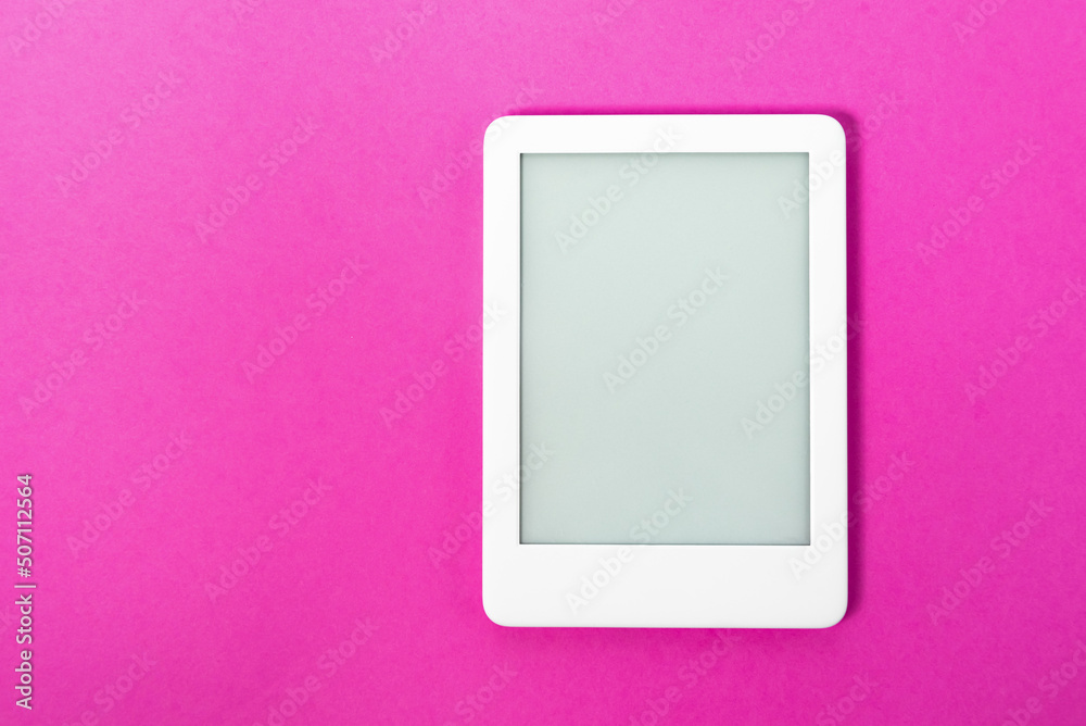 Ebook reader over pink background Stock Photo | Adobe Stock