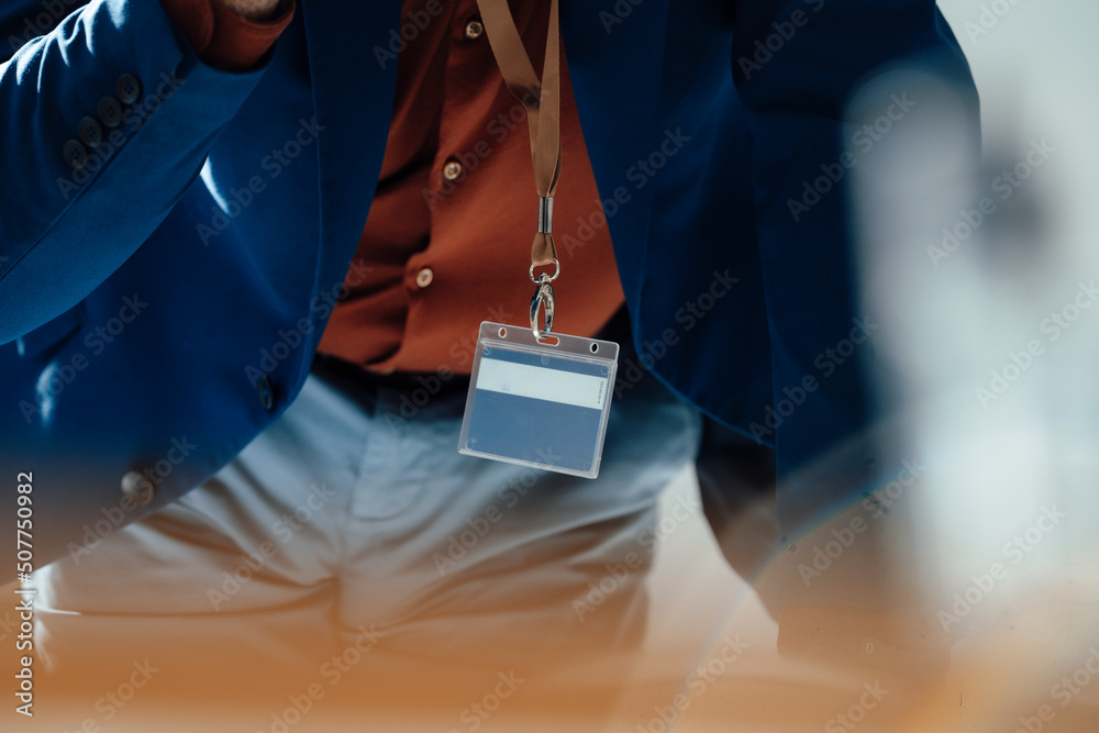 Senior businessman wearing ID card at office Stock Photo | Adobe Stock