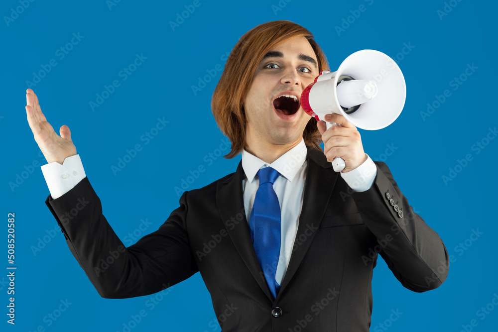 Young man using an electric megaphone. Guy with speaking-trumpet ...