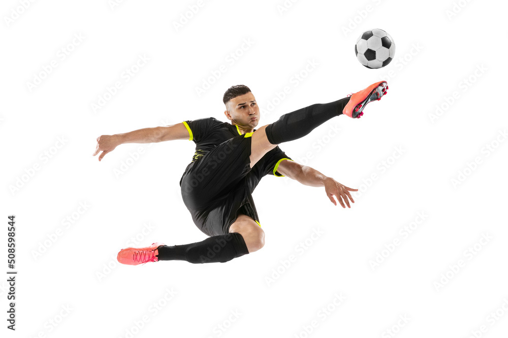 Professional male football soccer player in motion and action isolated ...