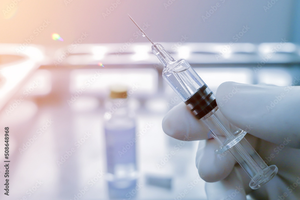 Medical hand gloves dispose medication drug needle syringe drug,concept flu shot vaccine vial ...