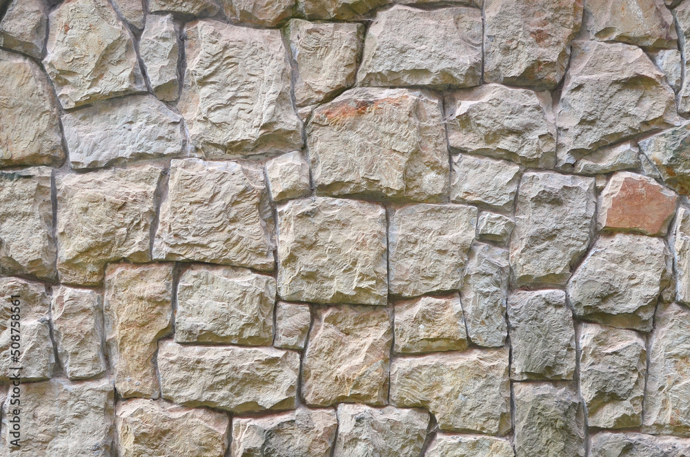 Natural broken stone cladding wall in sand-beige colors .Building ...
