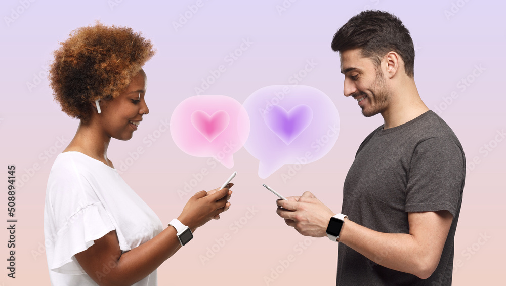 Side view of black girl and Caucasian with phones guy liking each other ...