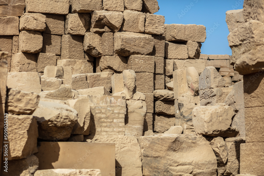 Statues of ancient Egyptian pharaohs and gods. Various hieroglyphs on ...