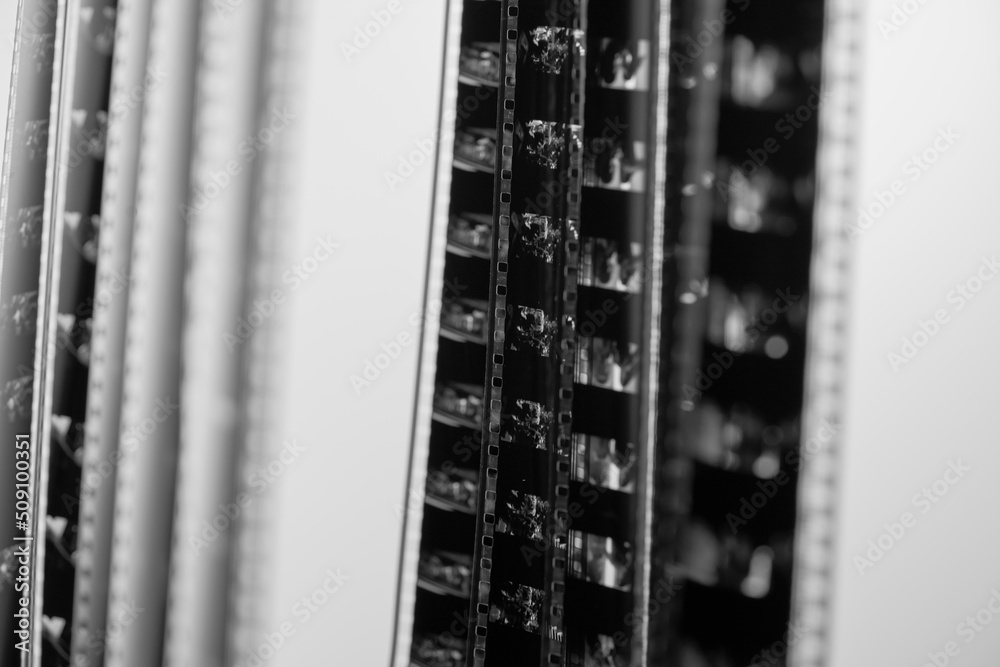 Camera negative film. Selective focus on film perforation. Black and ...