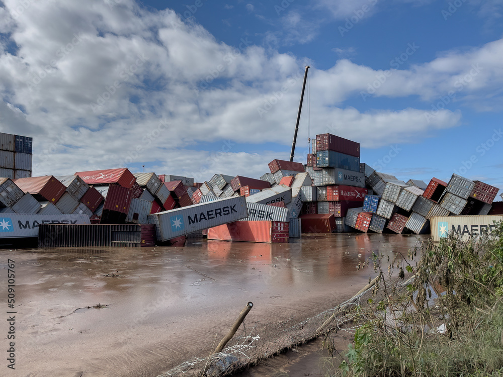 Stock-Foto „Following devastating storms, fallen shipping containers ...
