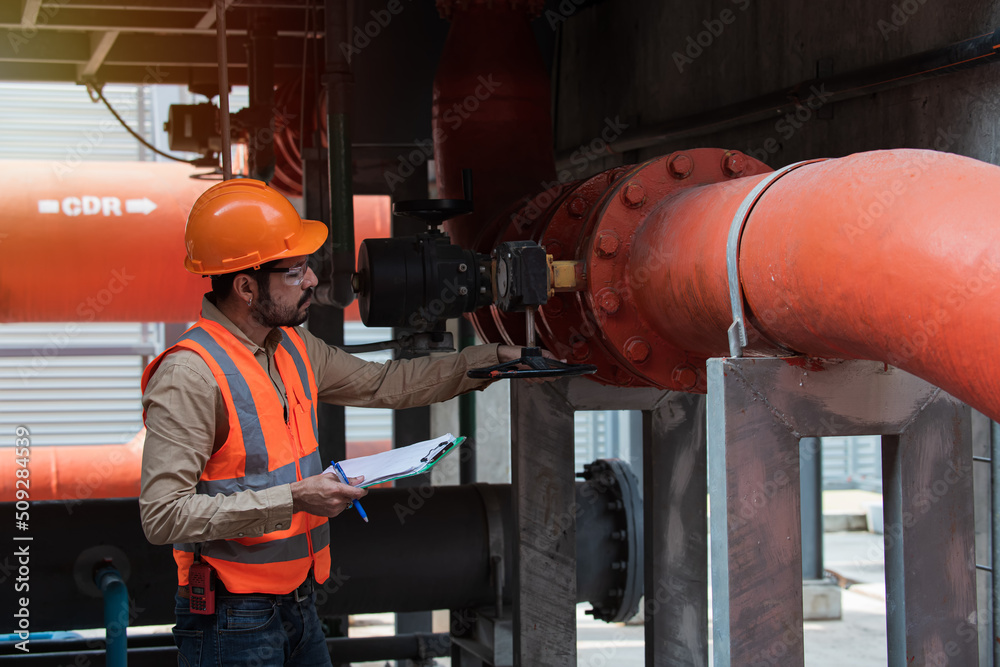 Engineer under checking the industry cooling tower air conditioner is ...