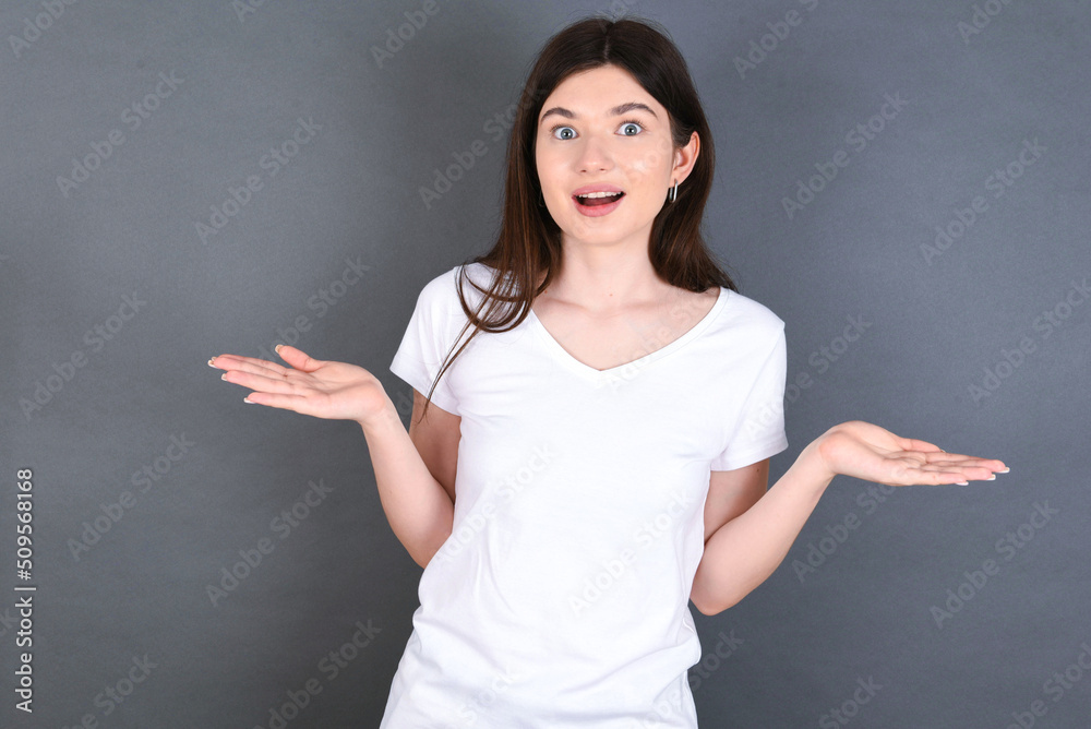 So what? Portrait of arrogant MODEL shrugging hands sideways smiling ...