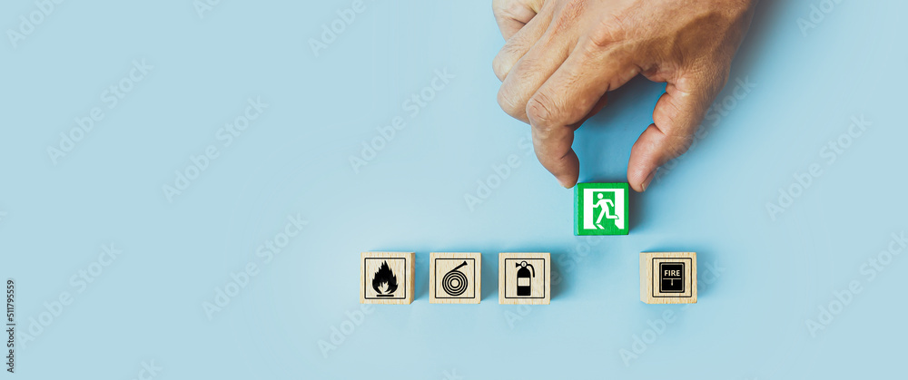 Foto de Stock Hand choose cube wooden block stack with door exit sing ...