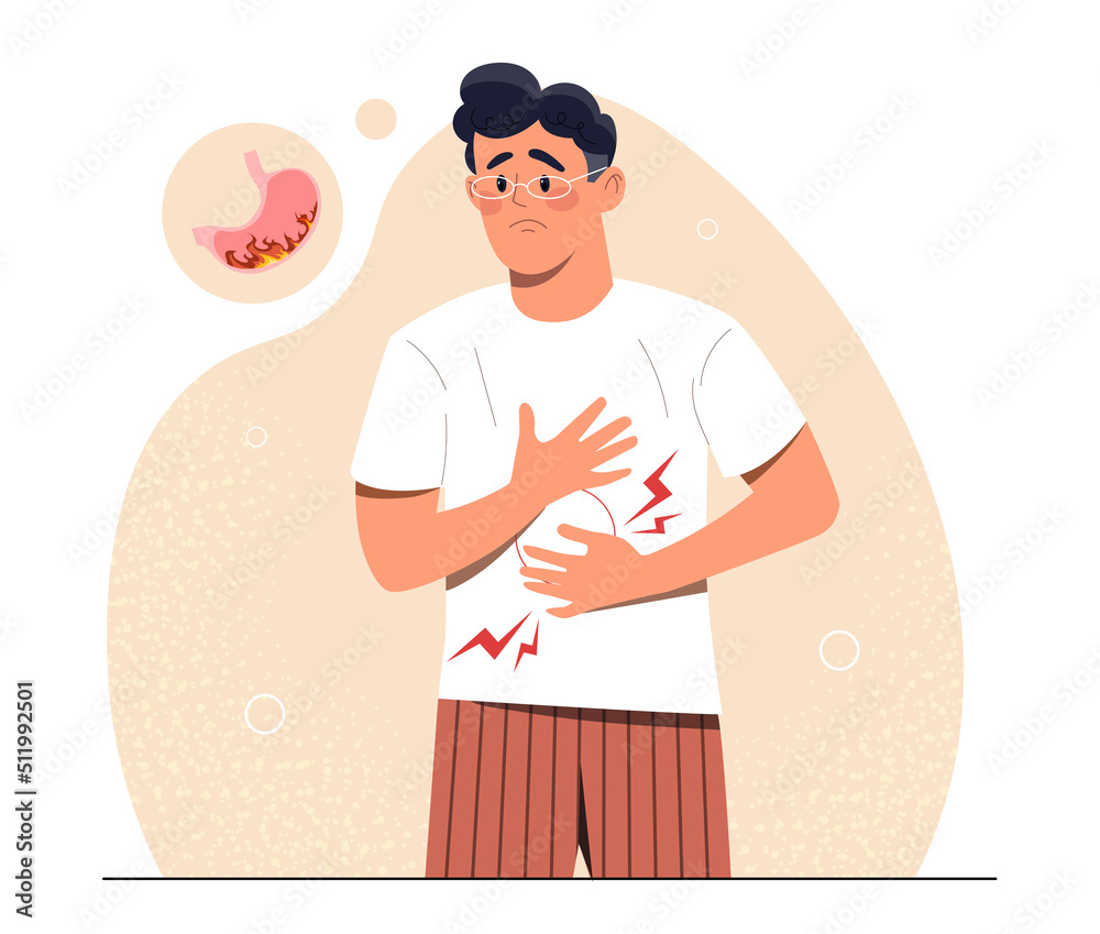 Abdomen pain concept. Young guy holds his stomach with both hands ...