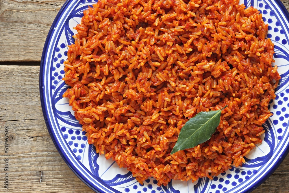 Zdjęcie bez tantiem: Jollof Rice. Traditional Nigerian spicy rice dish ...