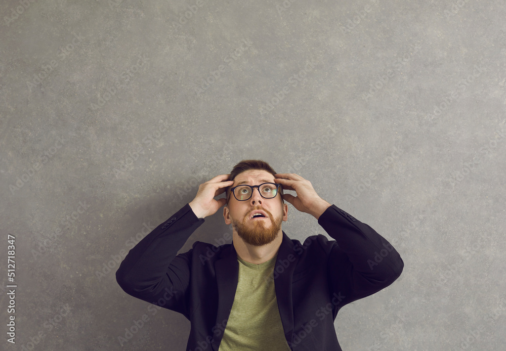 Young man afraid of something. Shocked scared anxious guy in hipster ...