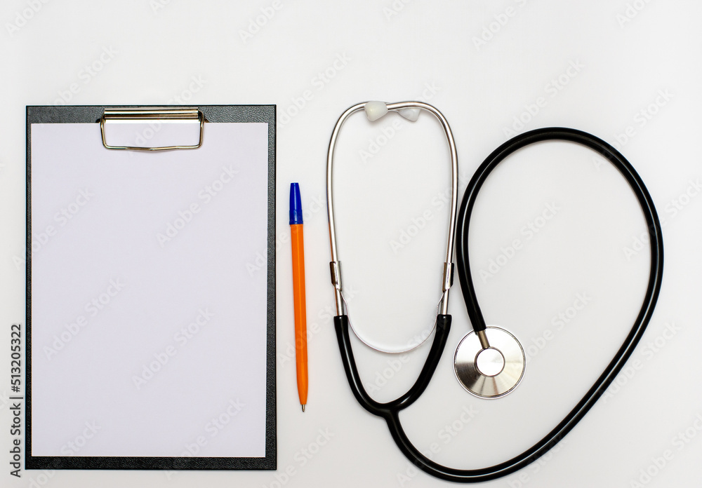 In the doctor's office, on the table is a stethoscope, a medical device ...