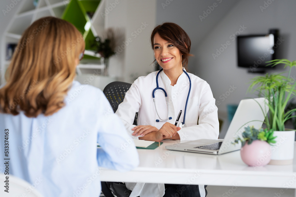 Female doctor consulting with her patient at the doctor's office Stock ...