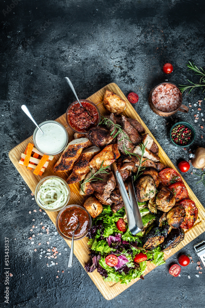 delicious grilled meat with vegetable. Mixed grilled bbq meat with ...
