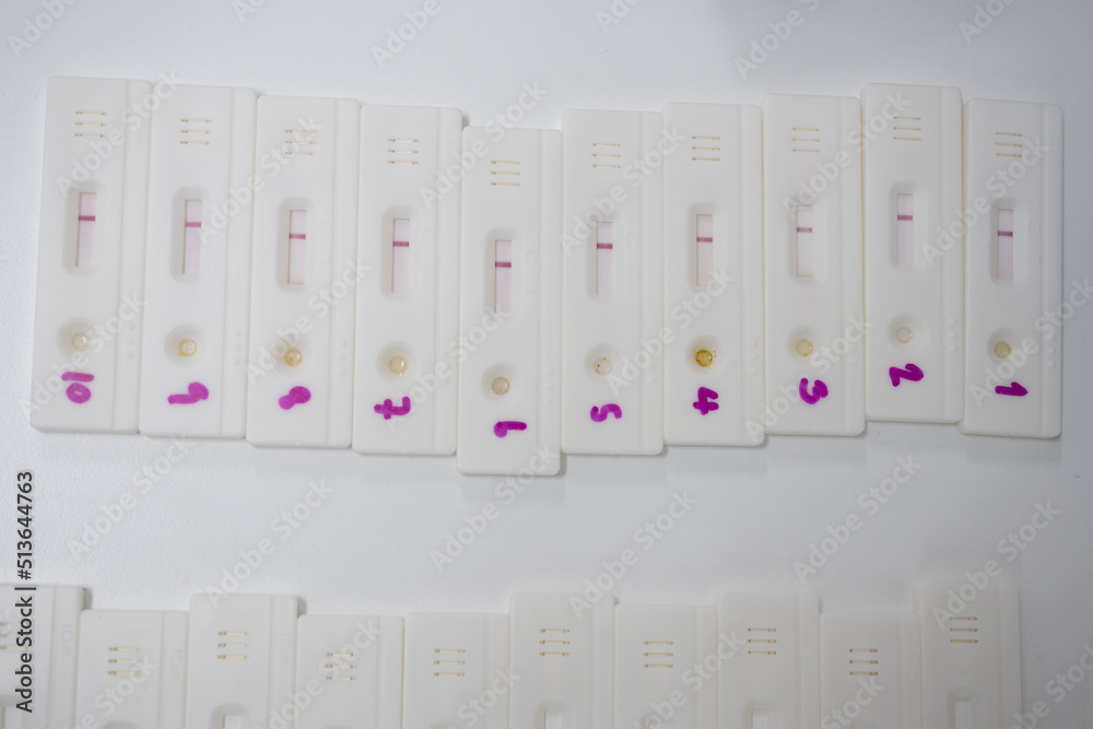 COVID-19, Antigen test kit (ATK) with a nasal swab on white background ...