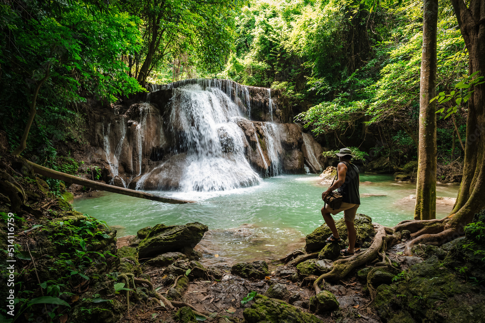 Foto de Stock Thai guy Asian man backpacker men enjoying beautiful emerald waterfalls green ...