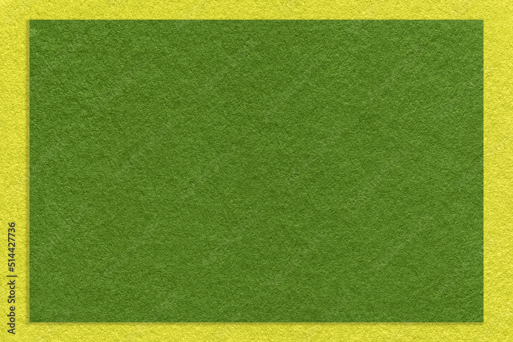 Texture of craft green color paper background with yellow border, macro ...