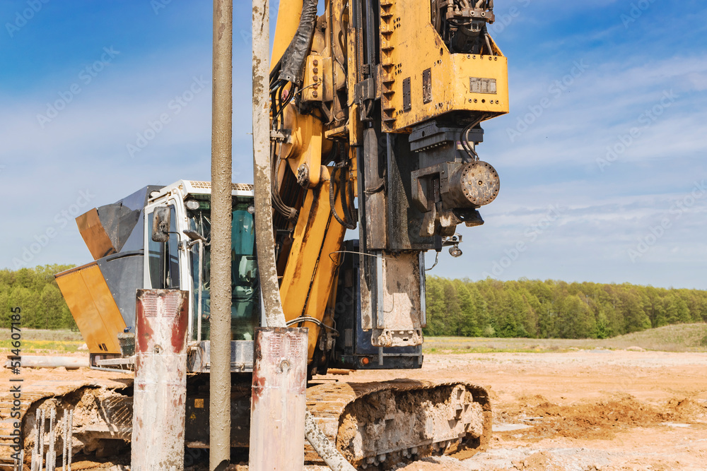 Hydraulic drilling machine at the construction site. Pile field. Modern ...