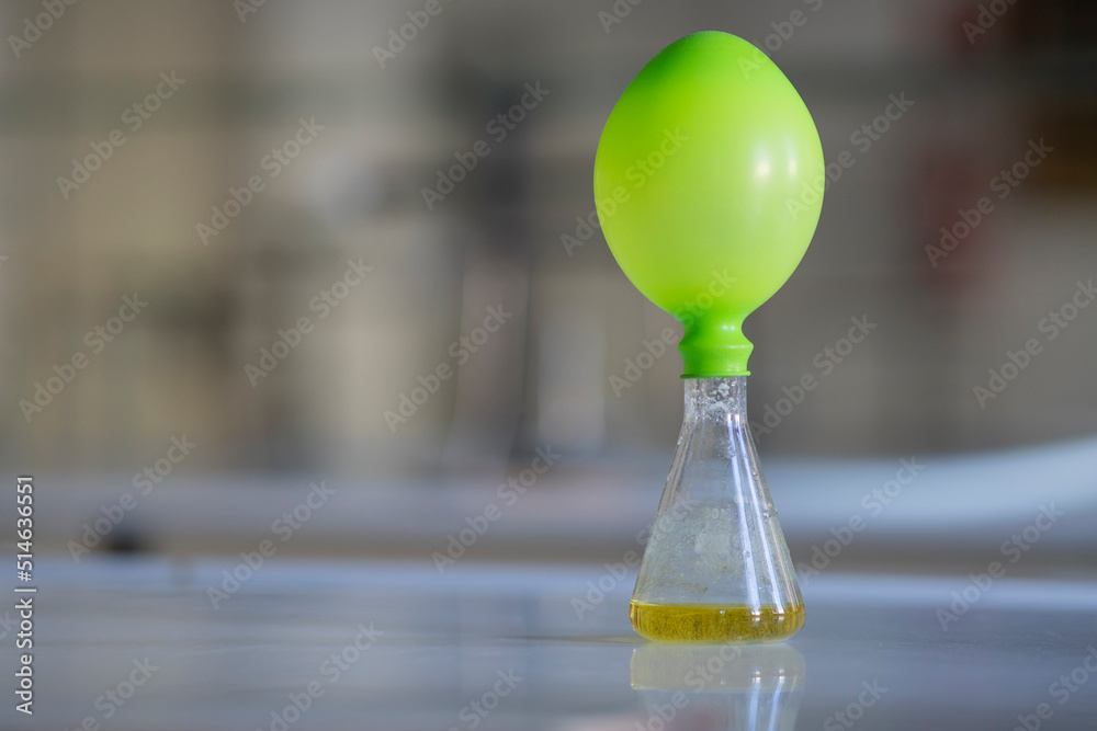 Chemistry experiment in the laboratory: balloon that inflates by ...