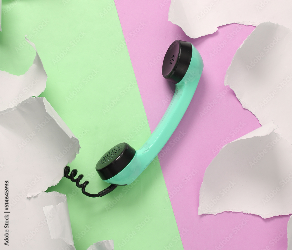 Retro phone tube on blue-pink background with torn paper. Concept art ...