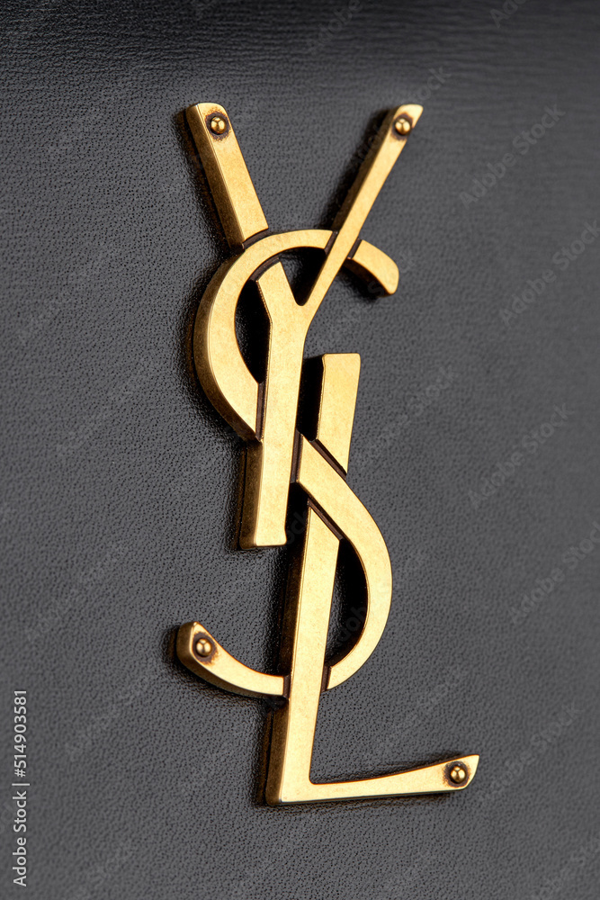 Yves Saint Laurent logo in the form of the letters YSL made of gold ...