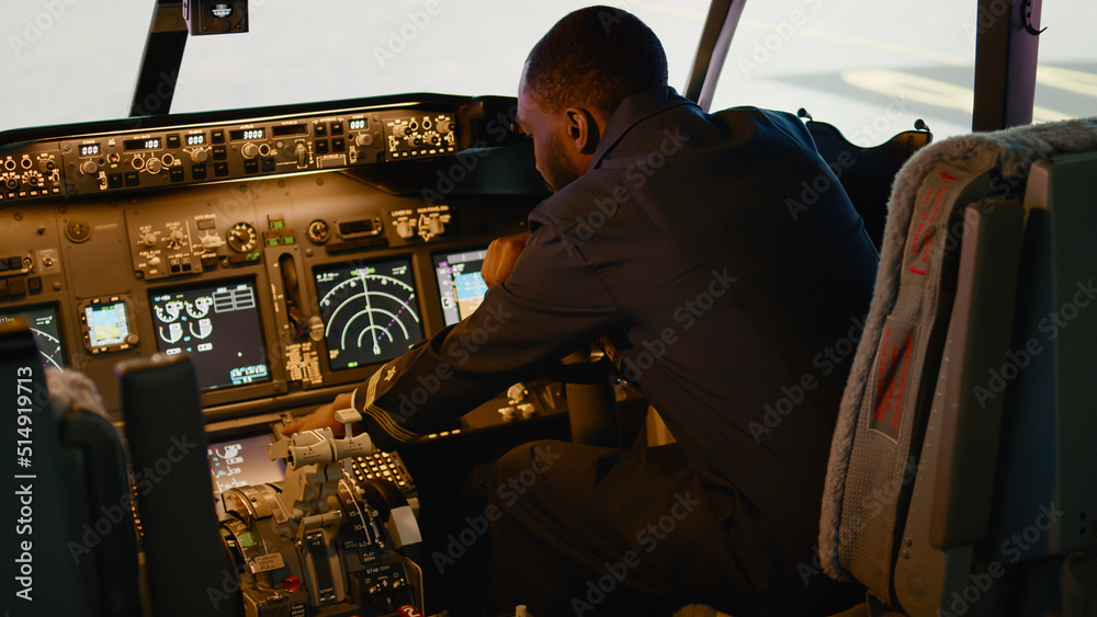 African American Captain Inserting Destination Coordinates On Control Panel And Dashboard In