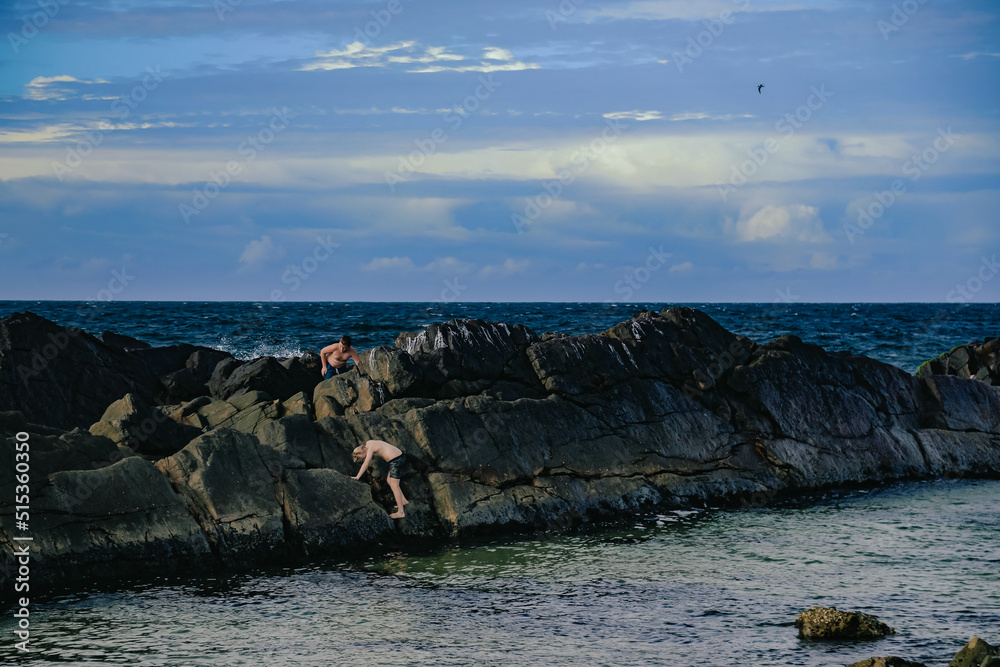 Foto stock di Kids climbing rock wall at The Tanks tourist attraction ...