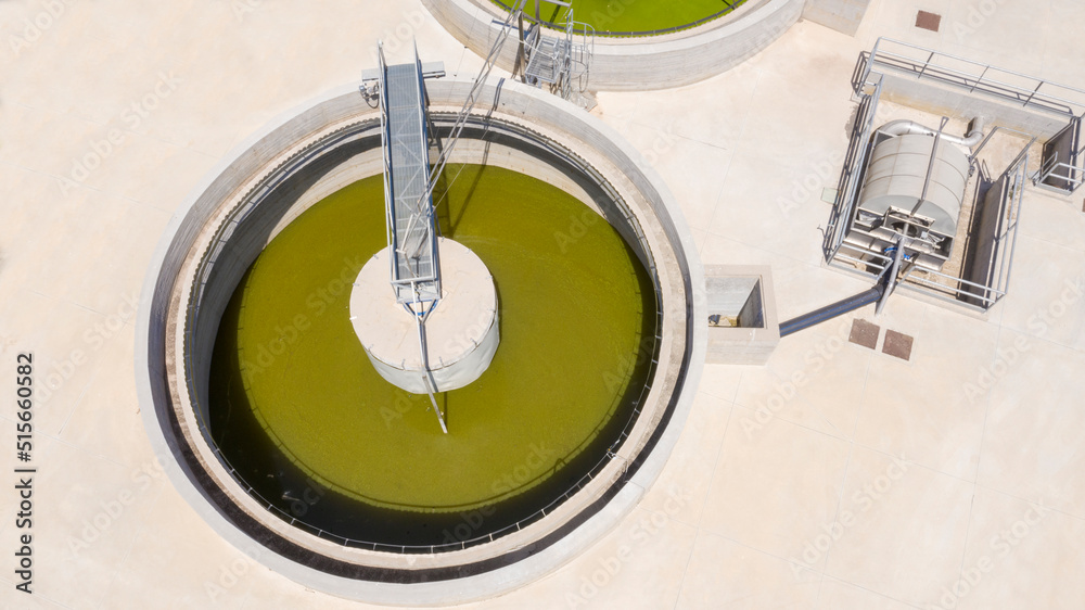Aerial view of the tanks of a sewage and water treatment plant enabling ...