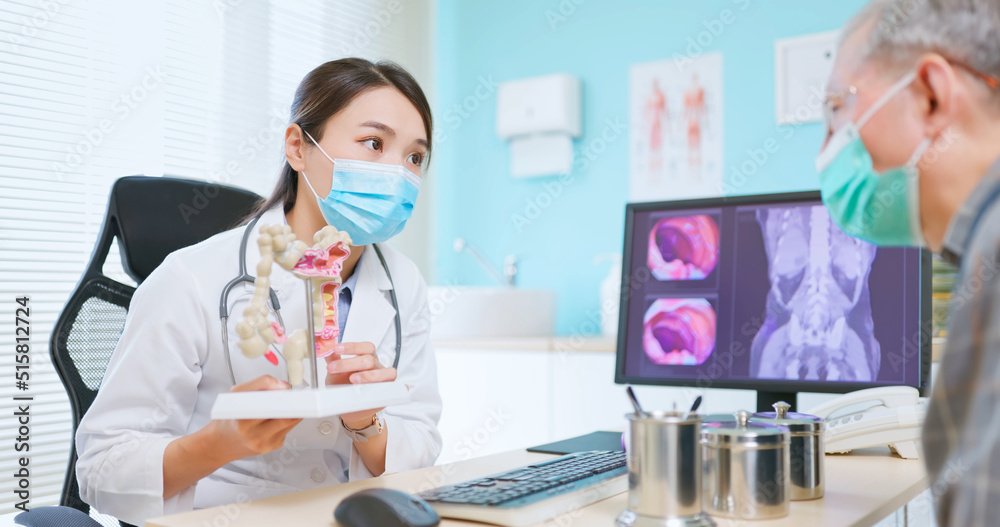 doctor show large intestine model Stock Photo | Adobe Stock