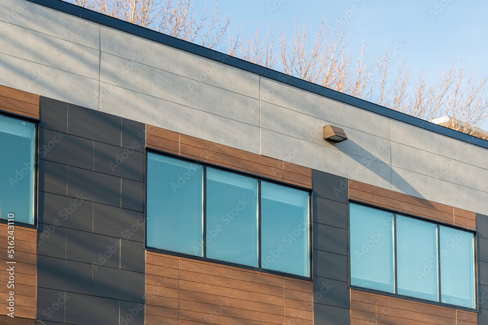 The exterior wall of a contemporary commercial style building with ...