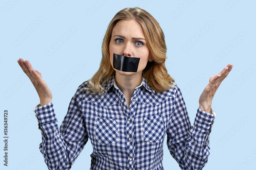 Photo Stock Female protestor with black tape over her mouth ...