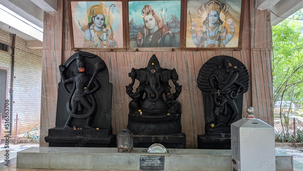 Closeup of Hanuman, Ganesha, Garuda stone statues with Rama, Shiva ...