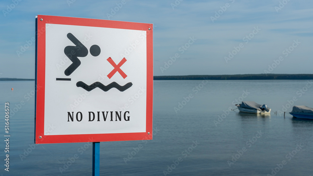 No Diving sign at beach, lake Naroch, Belarus. Warning sign of shallow ...