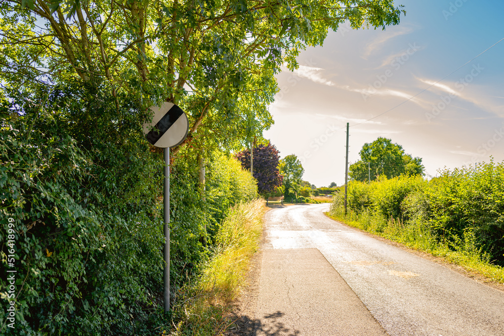 British national speed limit roadsigns seen at the end of a rural ...