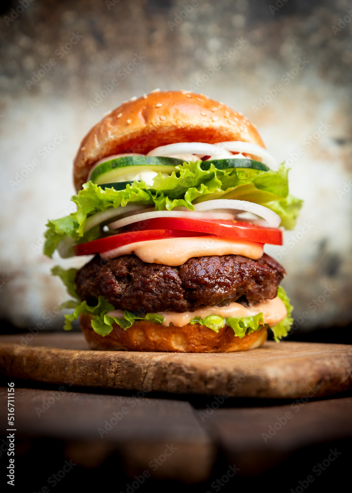 Burger with beef meat, cheese, lettuce, onion, tomato, cucumber, mayo ...