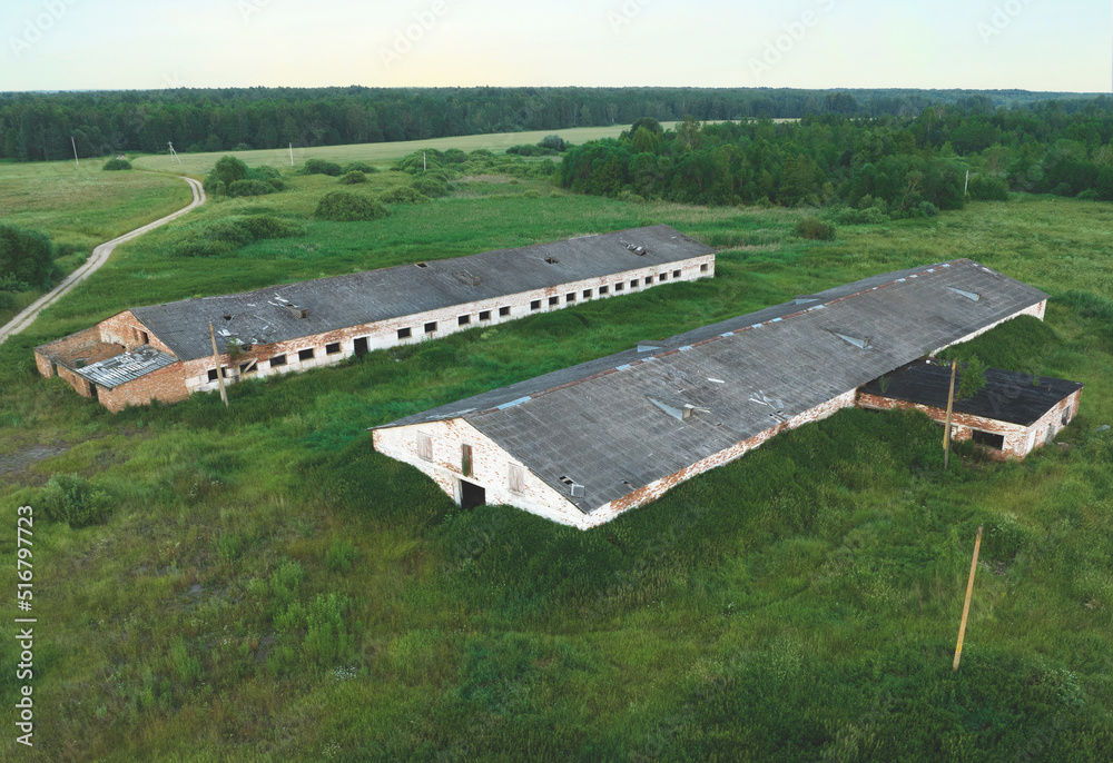 Abandoned farm. Old farm building with a destroyed cowshed. Abandoned ...