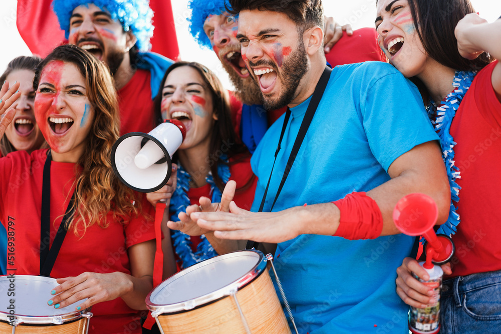 Crazy sport fans screaming while supporting their football team - Focus ...
