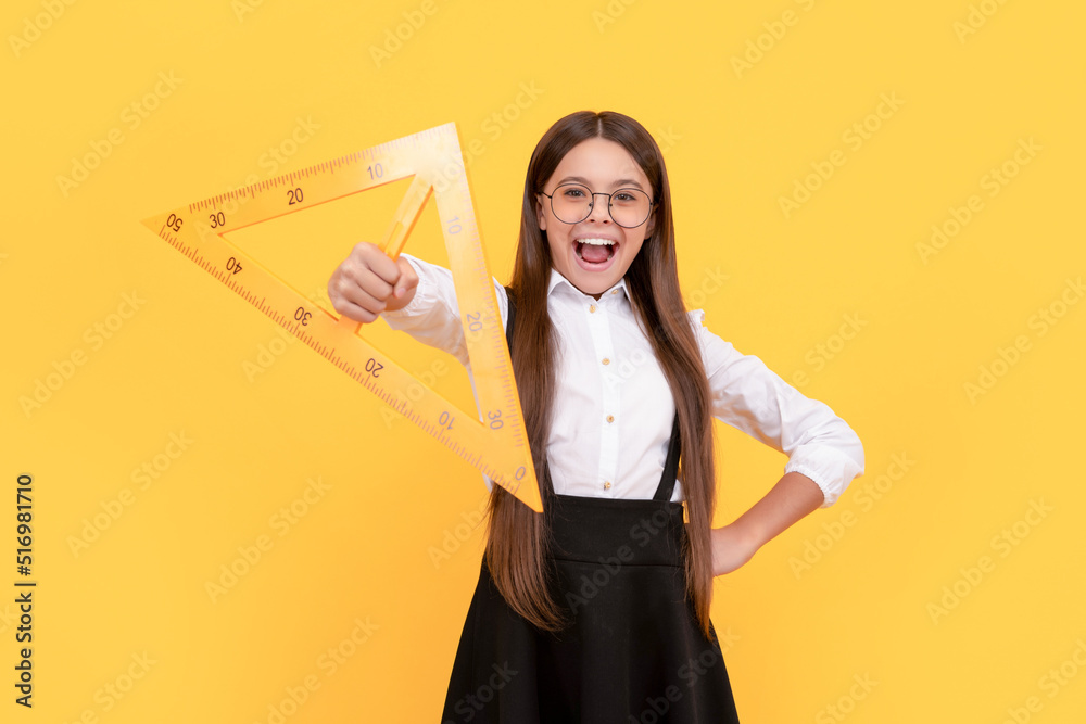 happy teen girl in school uniform and glasses hold mathematics triangle ...
