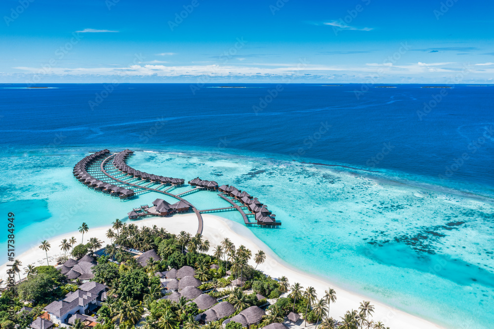 Aerial view of Maldives island, luxury travel water villas resort and ...