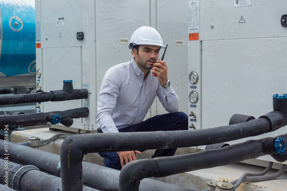 Engineer under checking the industry chilled water fan coil unit air ...