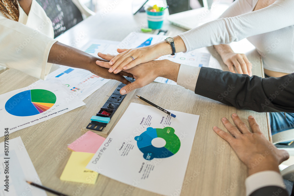 Diverse colleagues gather putting their hands together. Stack of hands ...
