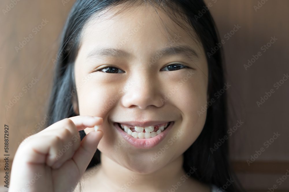 Foto de Stock closeup face asian child or kid girl smiling for show ...