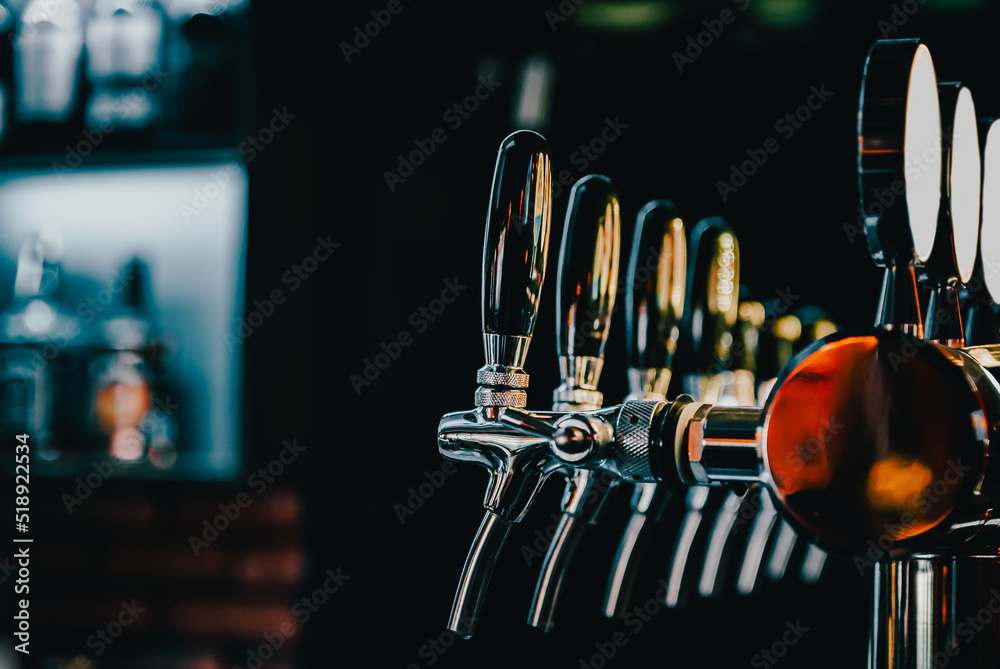 many beer taps in bar or pub Stock Photo | Adobe Stock