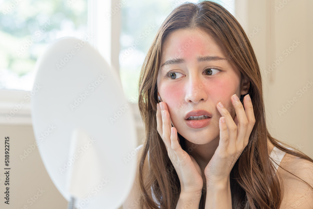Dermatology, puberty asian young woman, girl looking into mirror ...