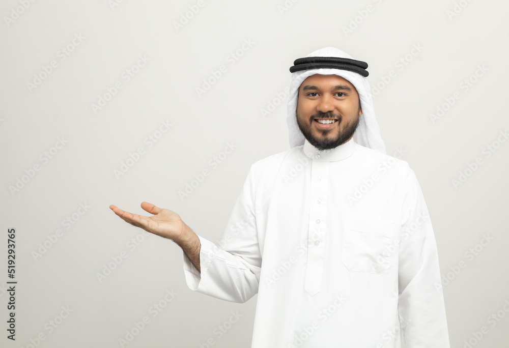 Portrait of arabic man with kandura dress on isolated white background ...