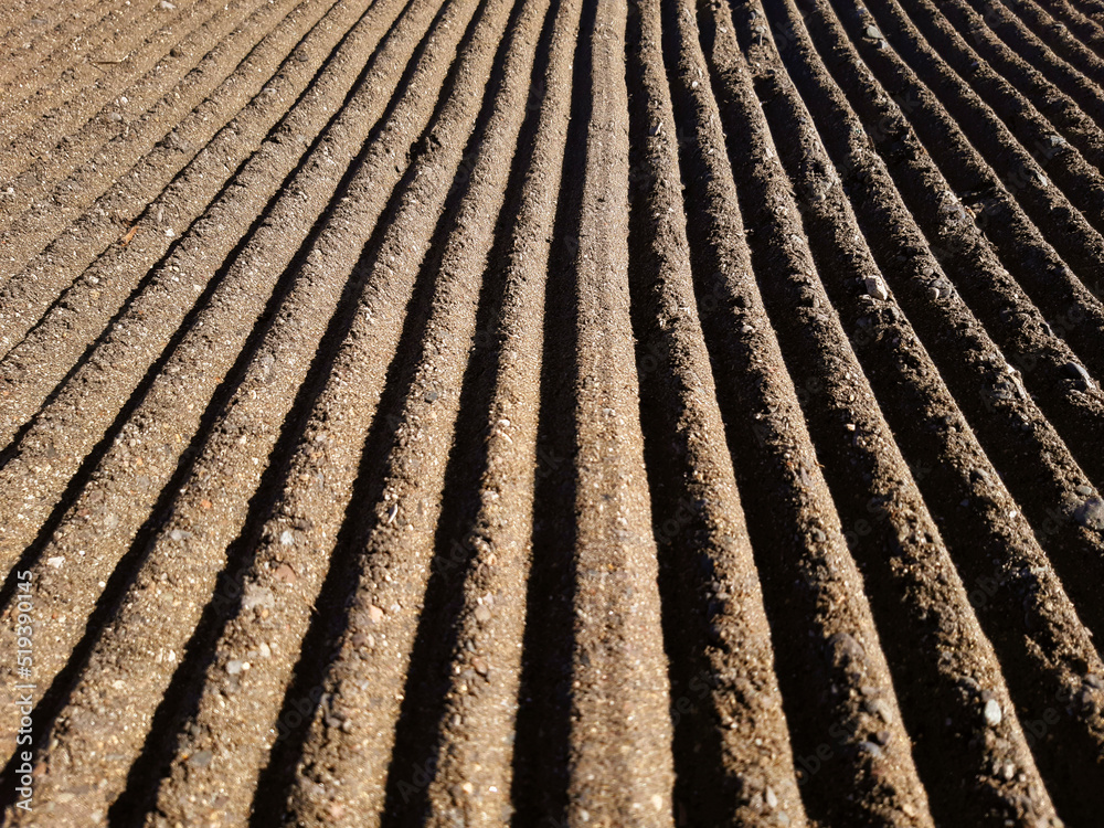 Perspective of deep grooves of sand. Background of raked white sand ...